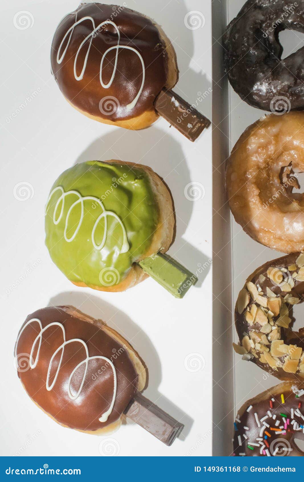 Different Flavours of Doughnuts Stock Photo - Image of iced, snack ...