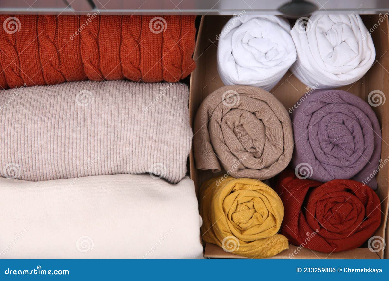 Different Folded Clothes As Background, Top View. Vertical Storage ...