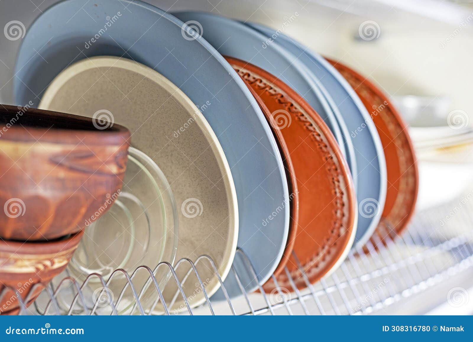 Different Food Plates Stand in the Kitchen Cabinet. Stock Photo - Image ...