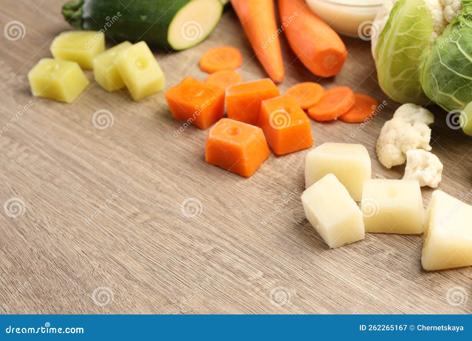 Different Frozen Purees Cubes and Fresh Vegetables on Wooden Table ...