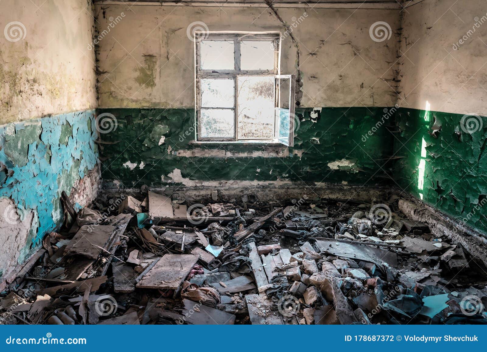 Ruined Room With Holes In Wall, Ceiling And Broken Windows In A Loft ...