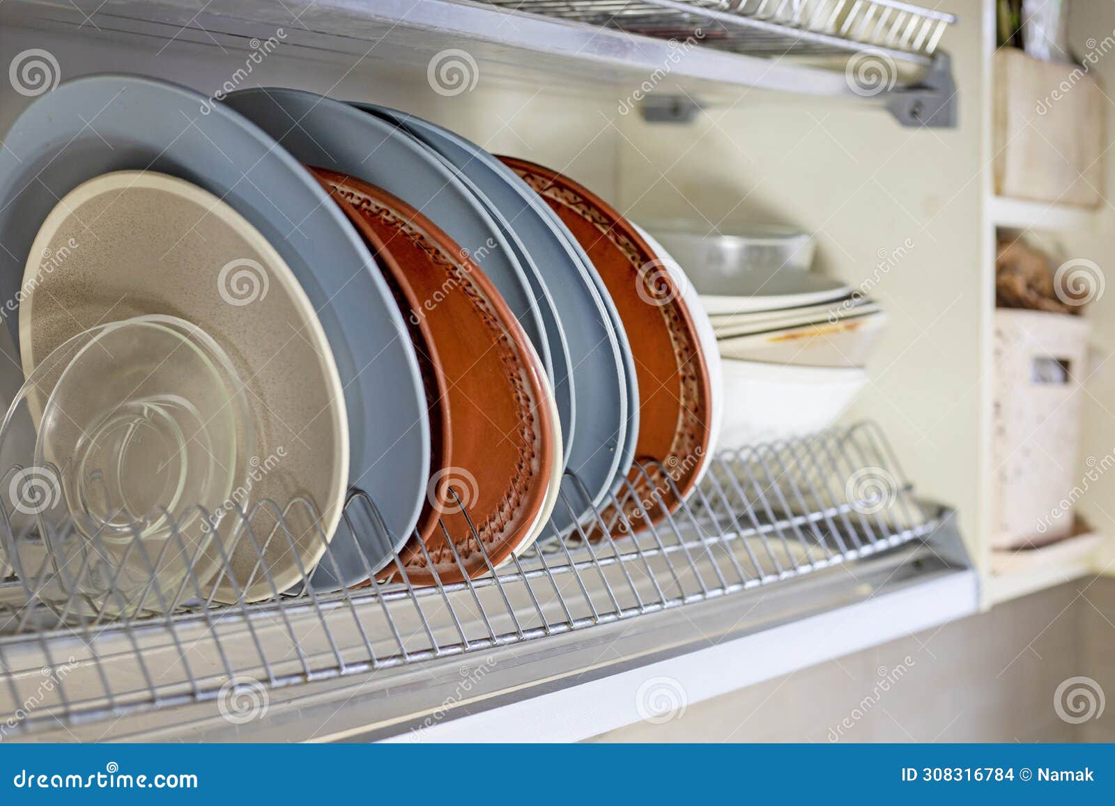 Different Glass and Ceramic Plates for Food Stand in the Kitchen ...