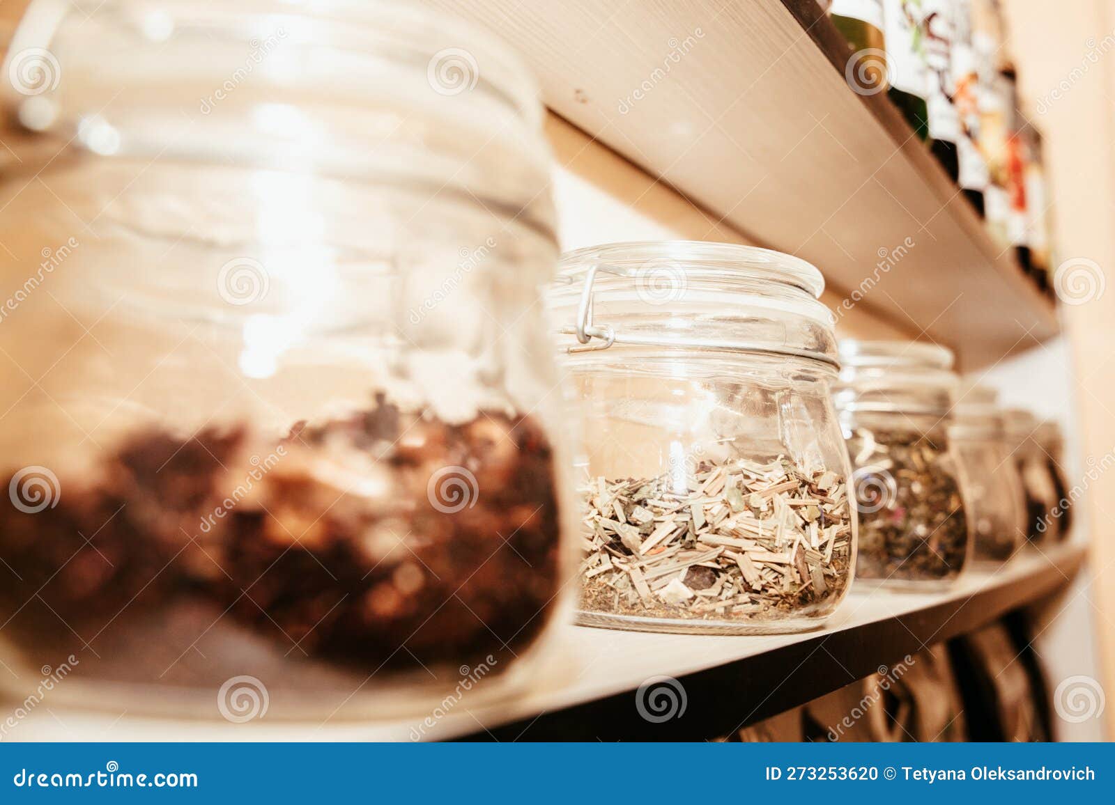 Different Glass Jars with Marshmallows and Chocolate on a Shelf in a ...