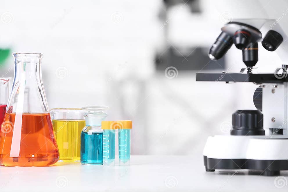 Different Glassware with Samples and Microscope in Chemistry Laboratory ...