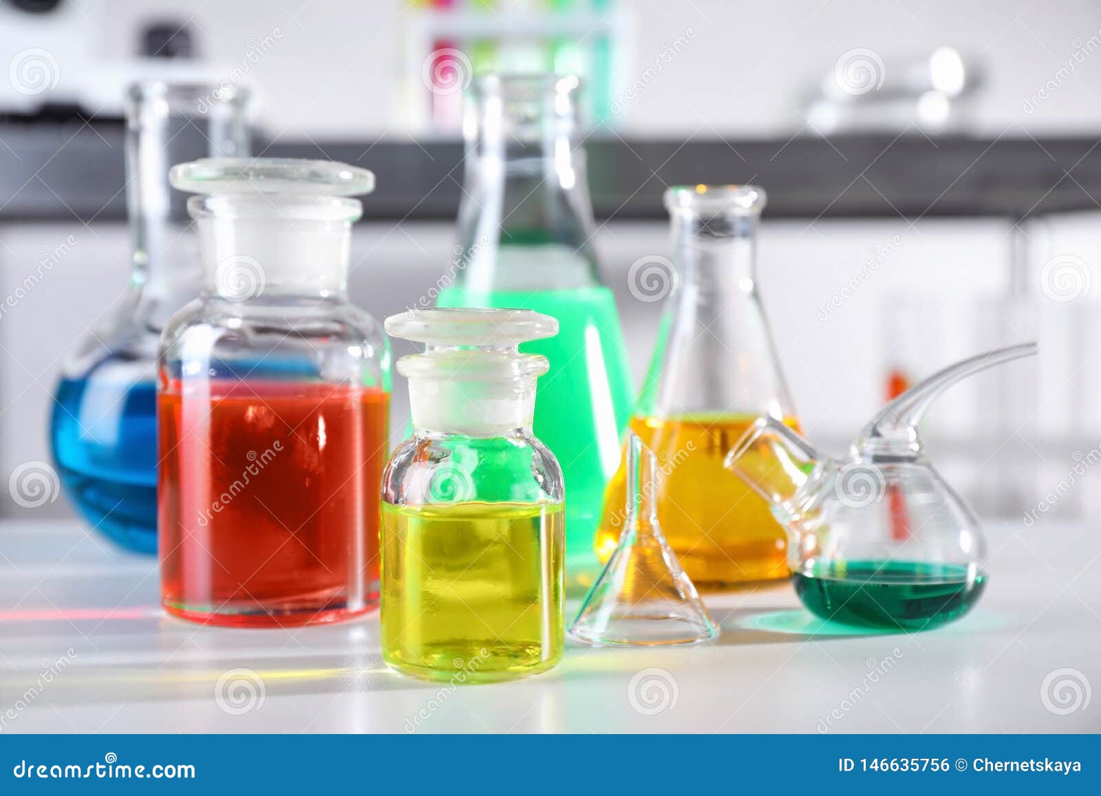 Different Glassware with Samples on Table in Laboratory Stock Photo ...