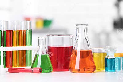Different Glassware with Samples on Table in Laboratory Stock Image ...