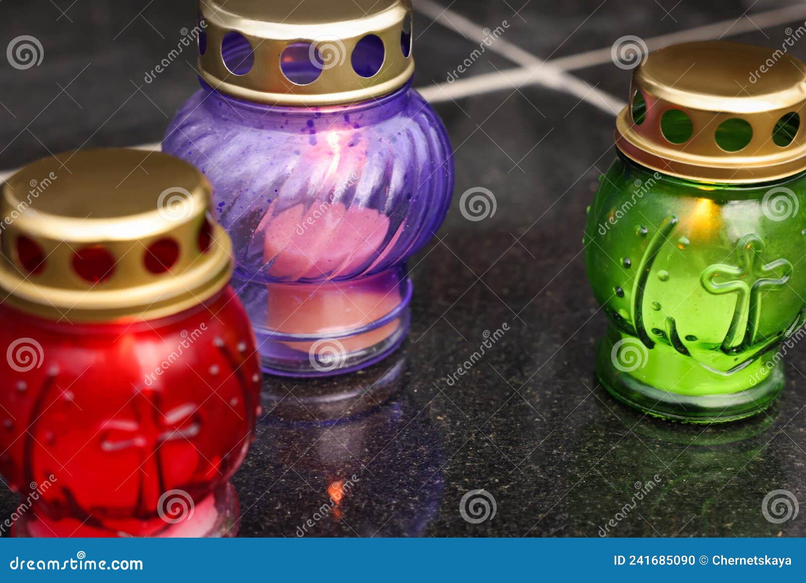 Different Grave Lanterns on Granite Surface at Cemetery Closeup Stock ...