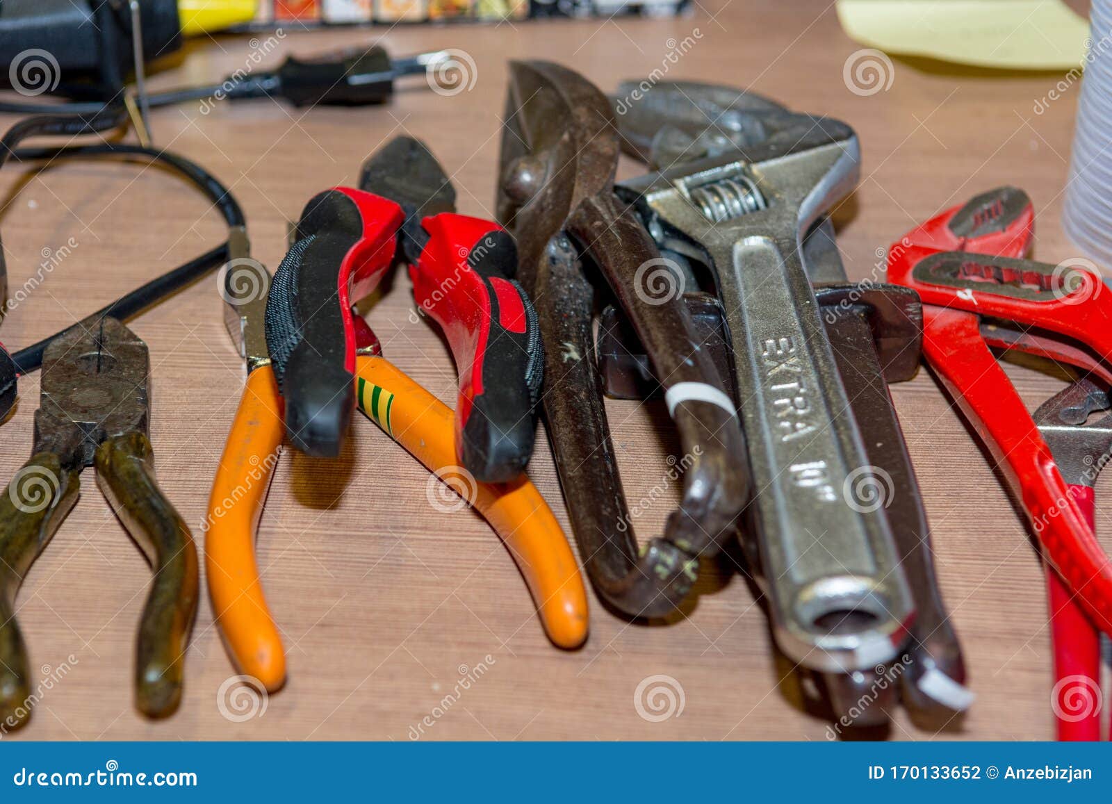 Different Hand Tools Stacked on a Wooden Table. Stock Photo - Image of ...