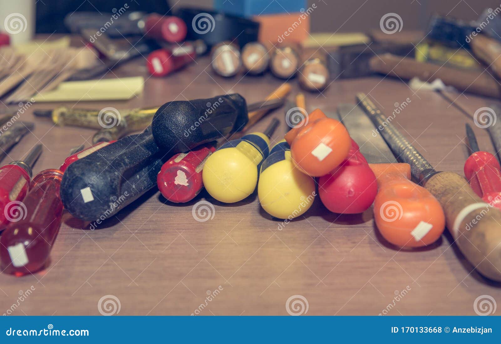 Different Hand Tools Stacked on a Wooden Table. Stock Photo - Image of ...
