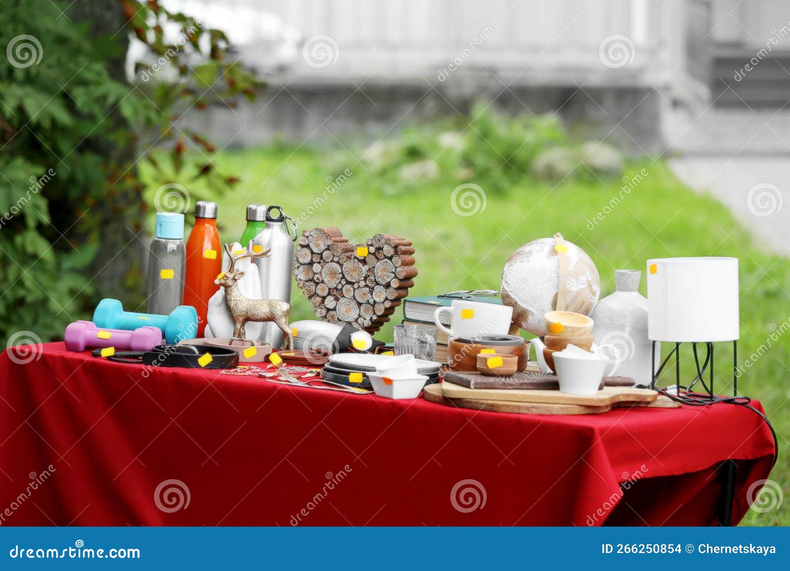 Different Items on Table in Yard. Garage Sale Stock Photo - Image of ...