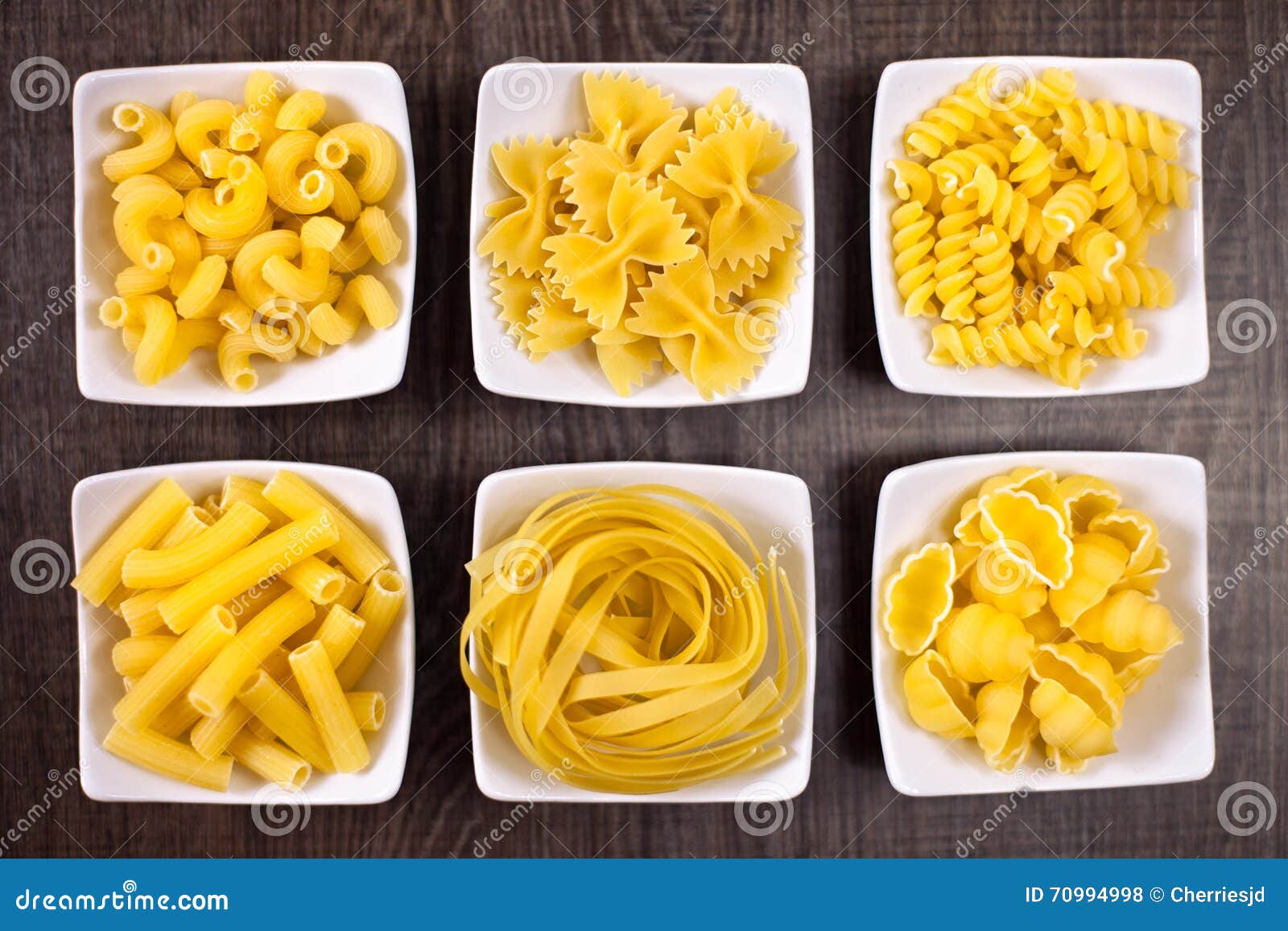 Different Kind of Raw Pasta in Small Bowl Stock Photo - Image of ...