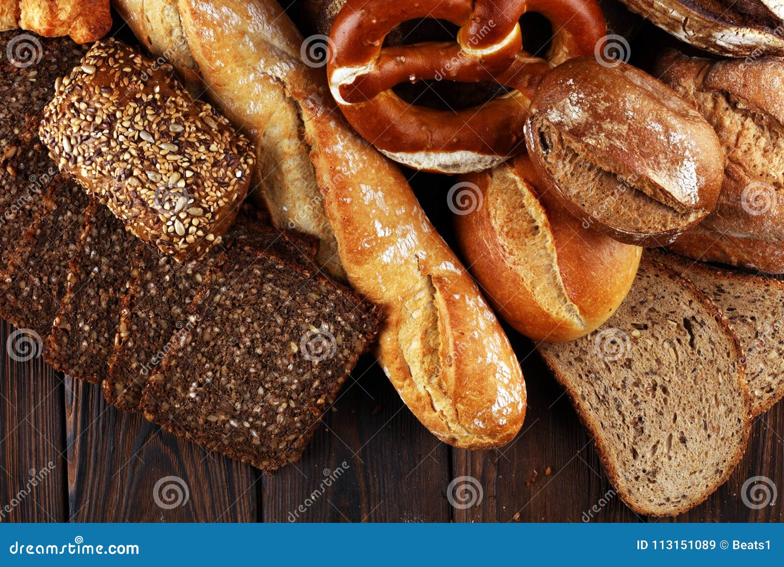 Different Kinds of Bread and Bread Rolls on Board from Above. Kitchen ...