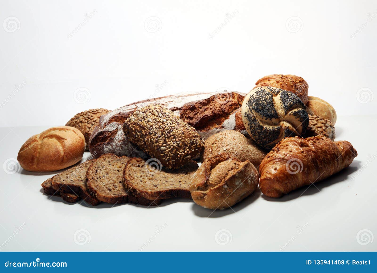 Different Kinds of Bread and Bread Rolls on Board from Above Stock ...