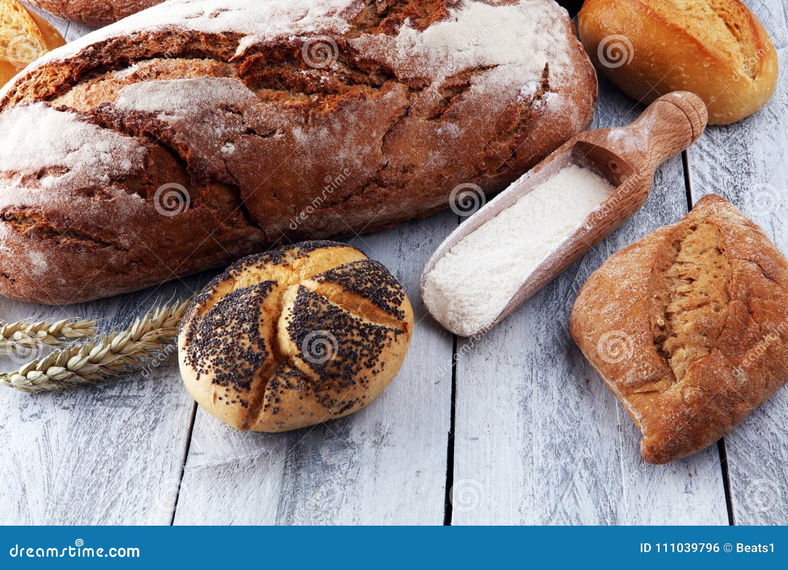 Different Kinds of Bread and Bread Rolls on White Board. Kitchen Stock ...