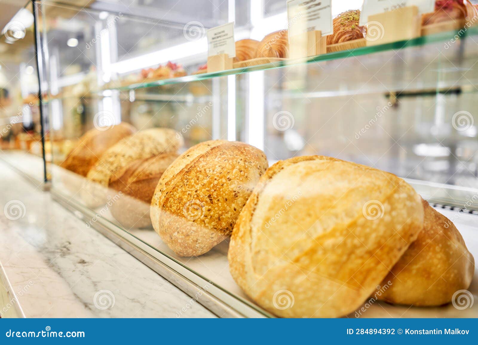 Different Kinds of Bread on the Counter in the Bakery Shop. Fresh Bread ...