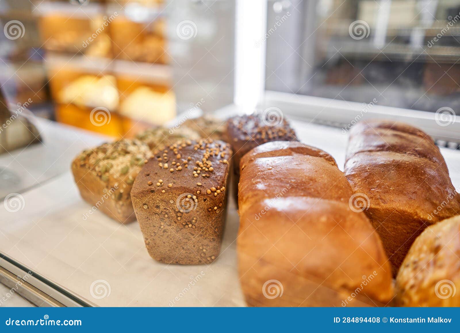 Different Kinds of Bread on the Counter in the Bakery Shop. Fresh Bread ...