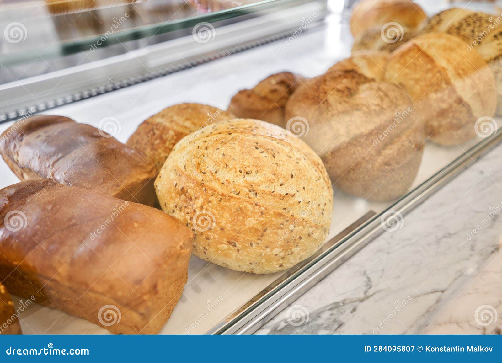 Different Kinds of Bread on the Counter in the Bakery Shop. Fresh Bread ...