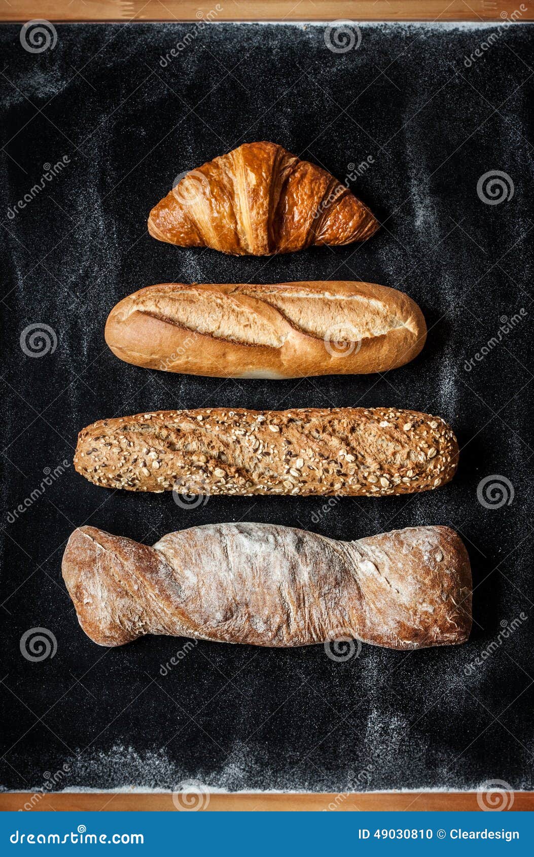 Different Kinds of Bread Rolls on Black from Above Stock Photo - Image ...