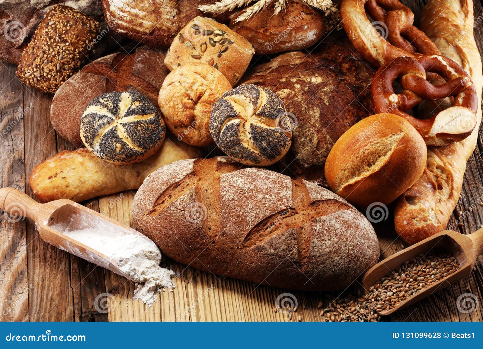 Different Kinds of Bread and Bread Rolls on Board from Above. Kitchen ...