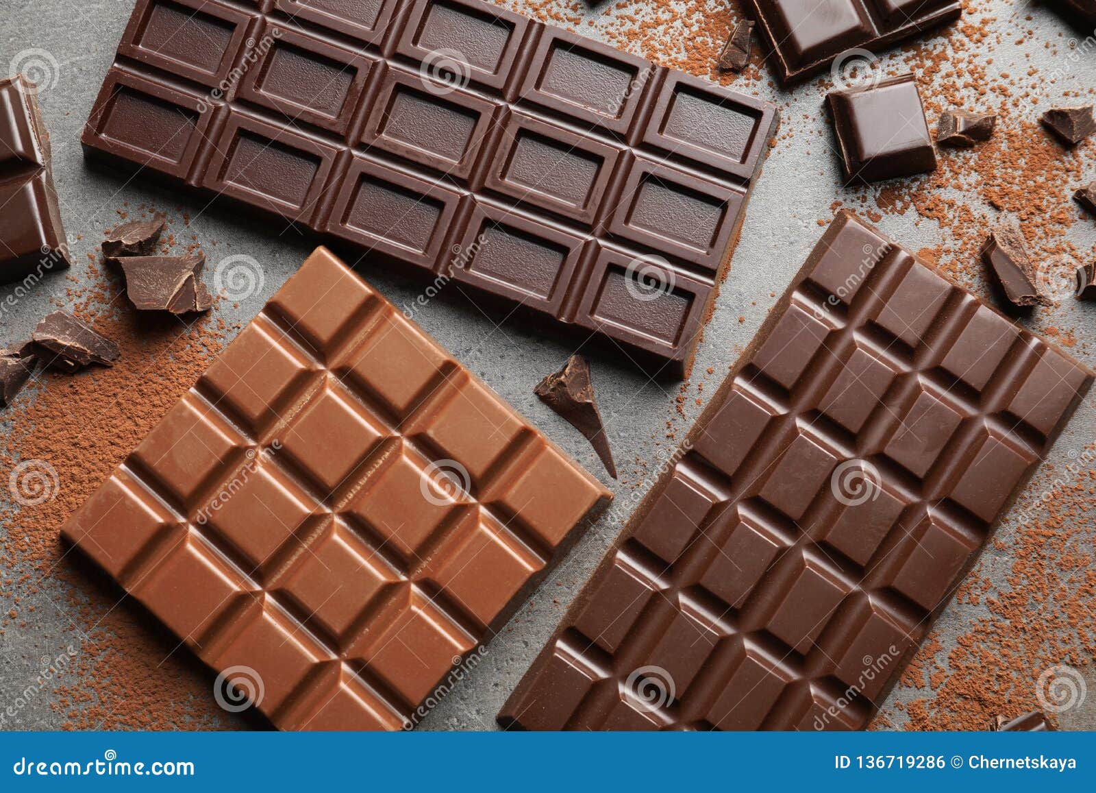Different Kinds of Chocolate on Grey Background Stock Photo - Image of ...