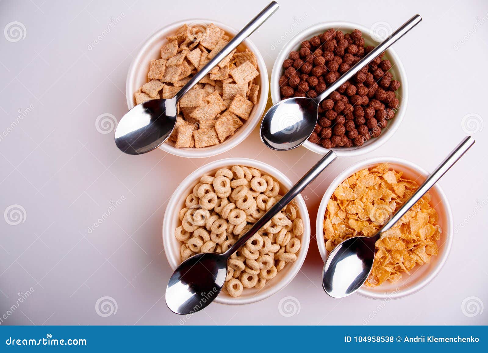Different Kinds of Flakes in Plates with Spoons on a White Background ...