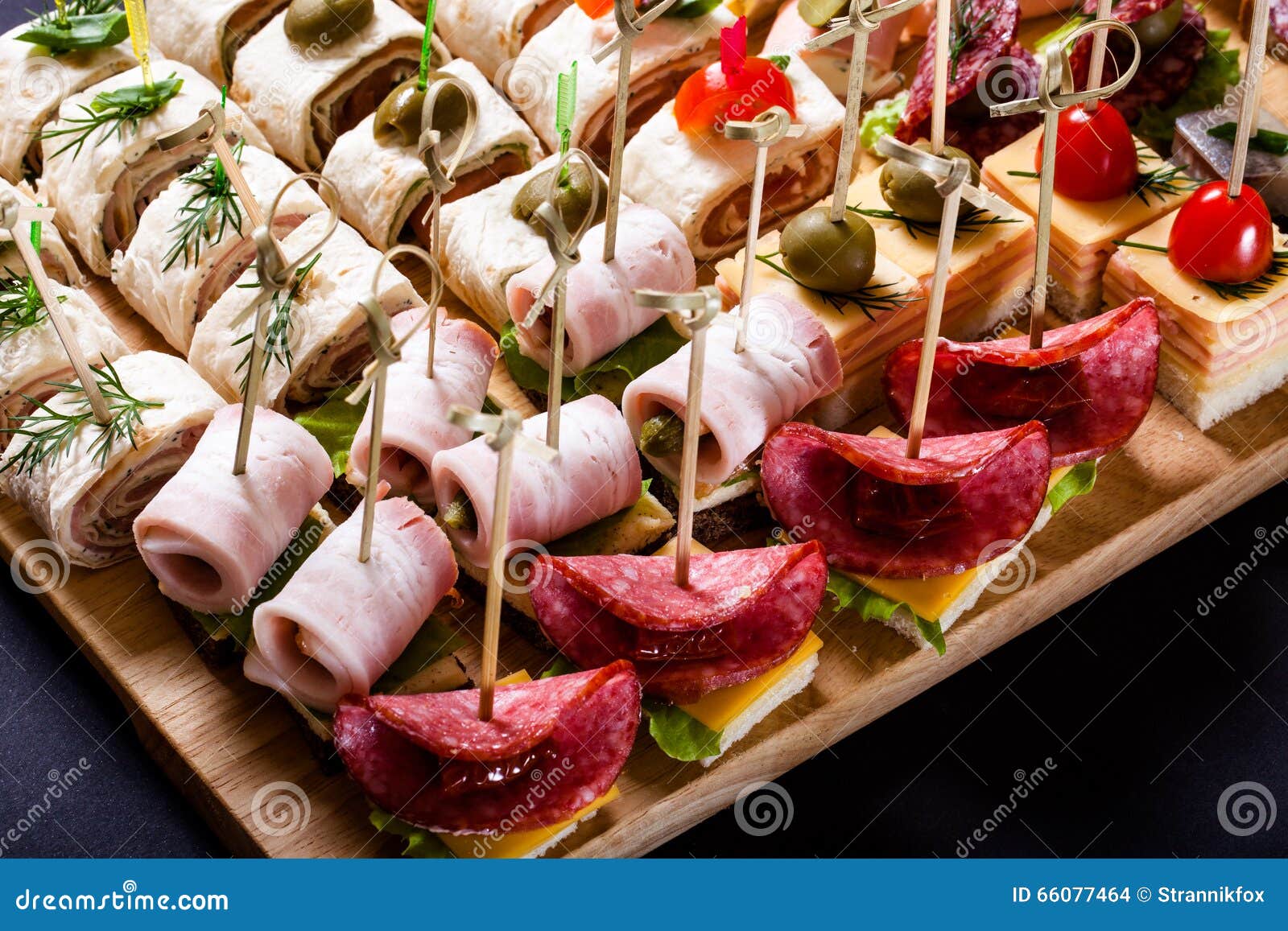 Different Kinds of Snacks Canape on Skewers. Selective Focus Stock ...