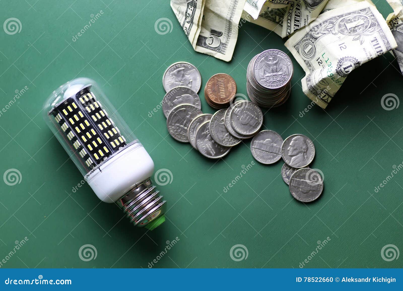 Different Lamps and Money Stack on Green Table Isolated Stock Photo ...