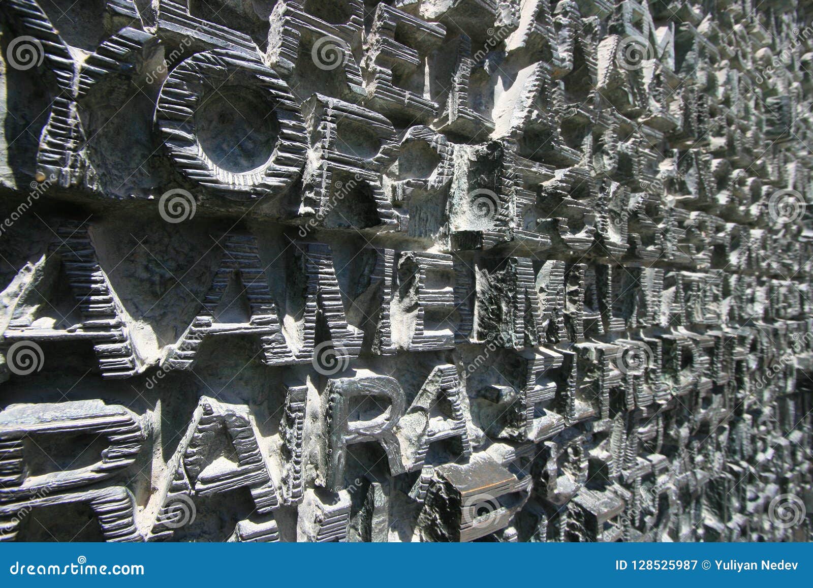 Different Letters Carved on a Stone Wall Stock Image - Image of closeup ...