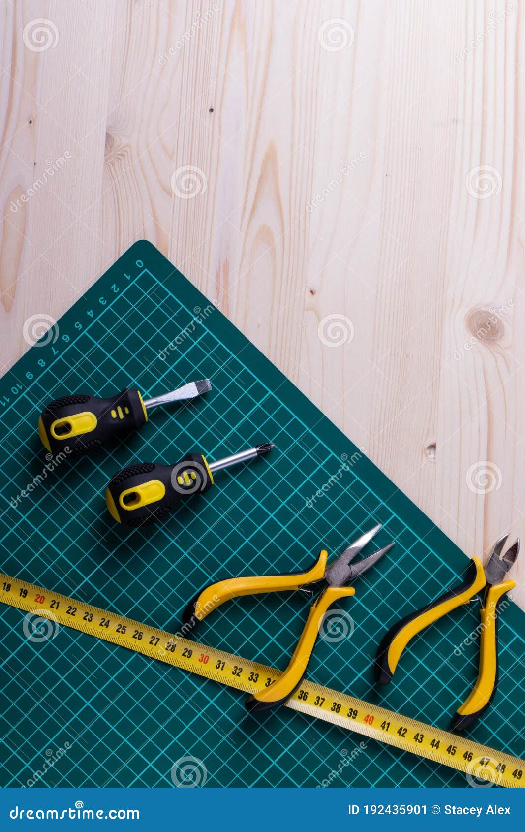 Different Mechanic or Electrician Worker Tools on the Green Checked Mat ...