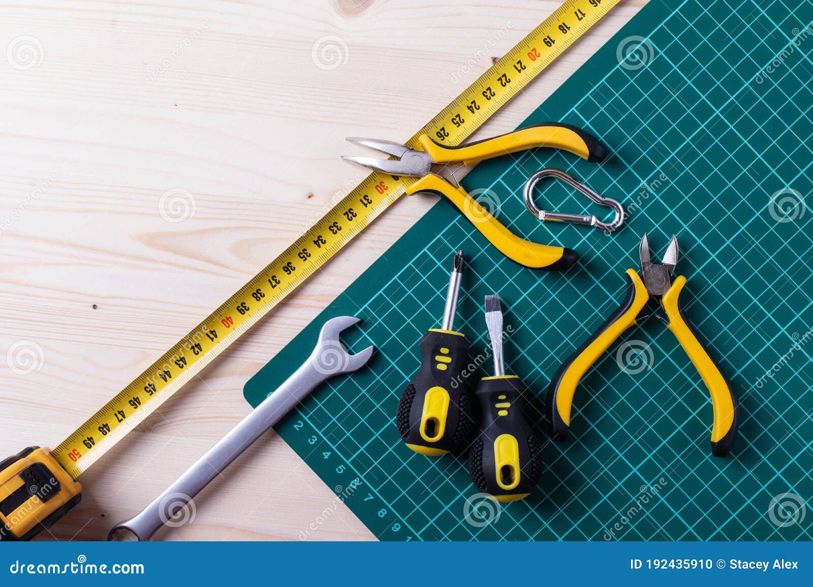 Different Mechanic or Electrician Worker Tools on the Green Checked Mat ...