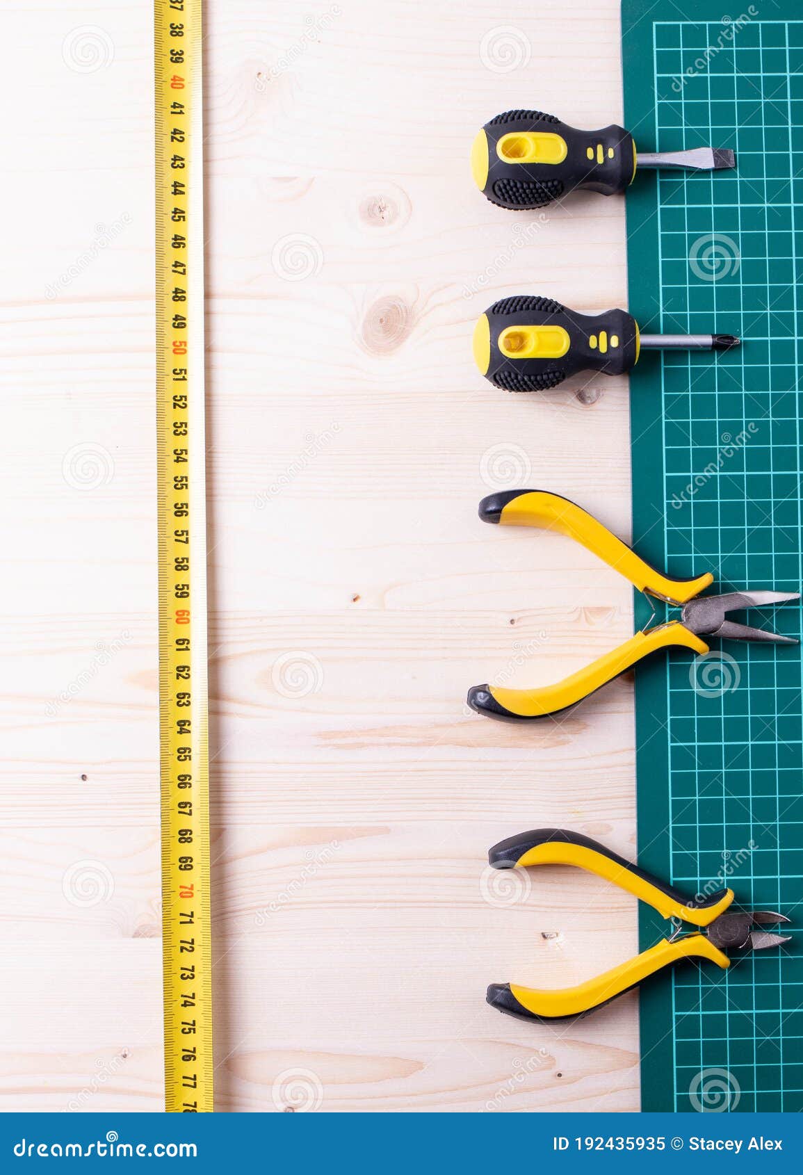 Different Mechanic or Electrician Worker Tools on the Green Checked Mat ...