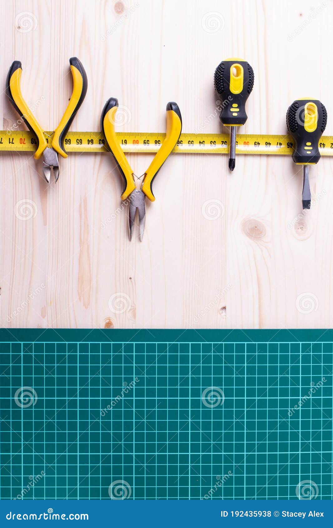 Different Mechanic or Electrician Worker Tools on the Green Checked Mat ...