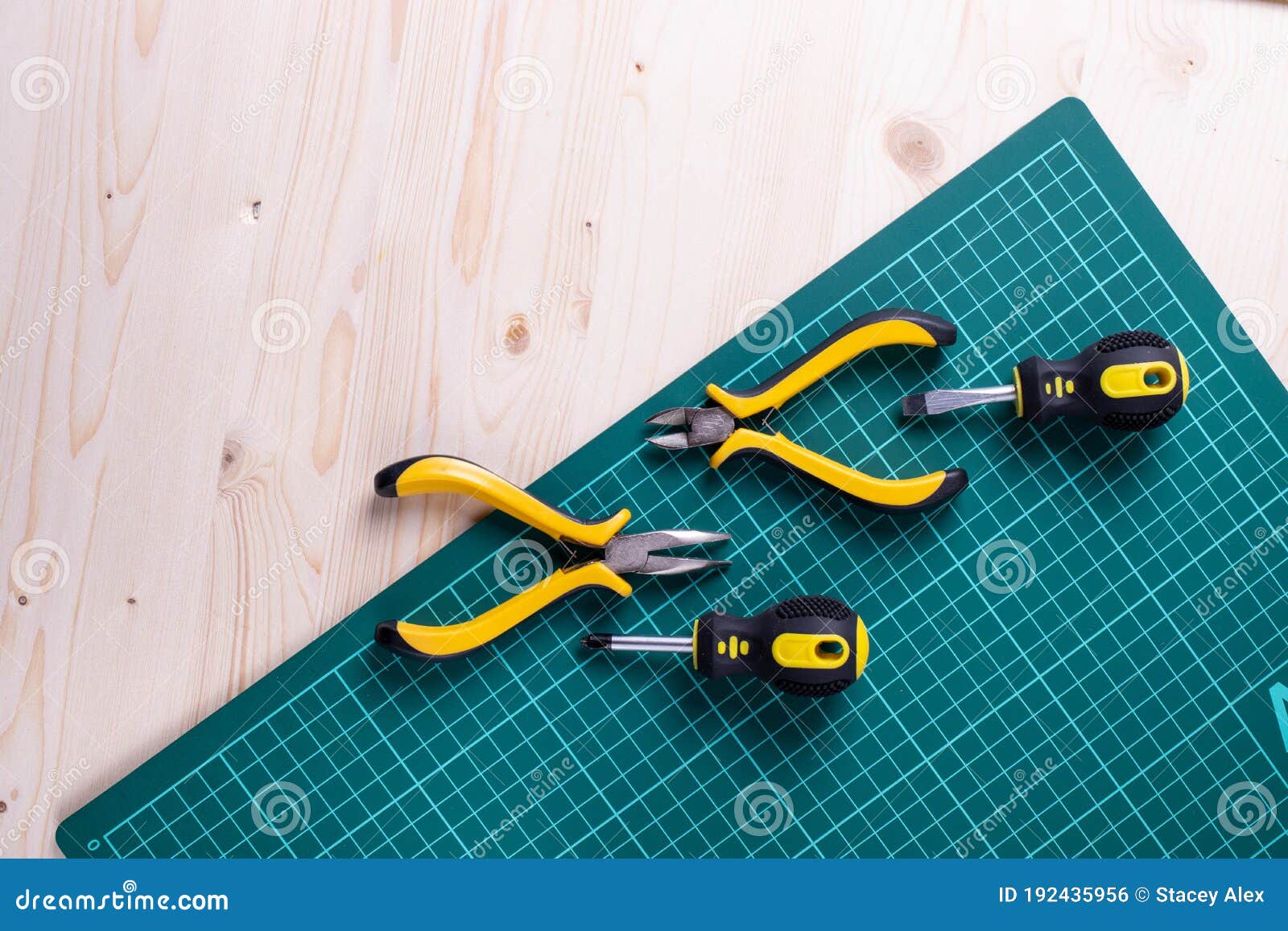 Different Mechanic or Electrician Worker Tools on the Green Checked Mat ...
