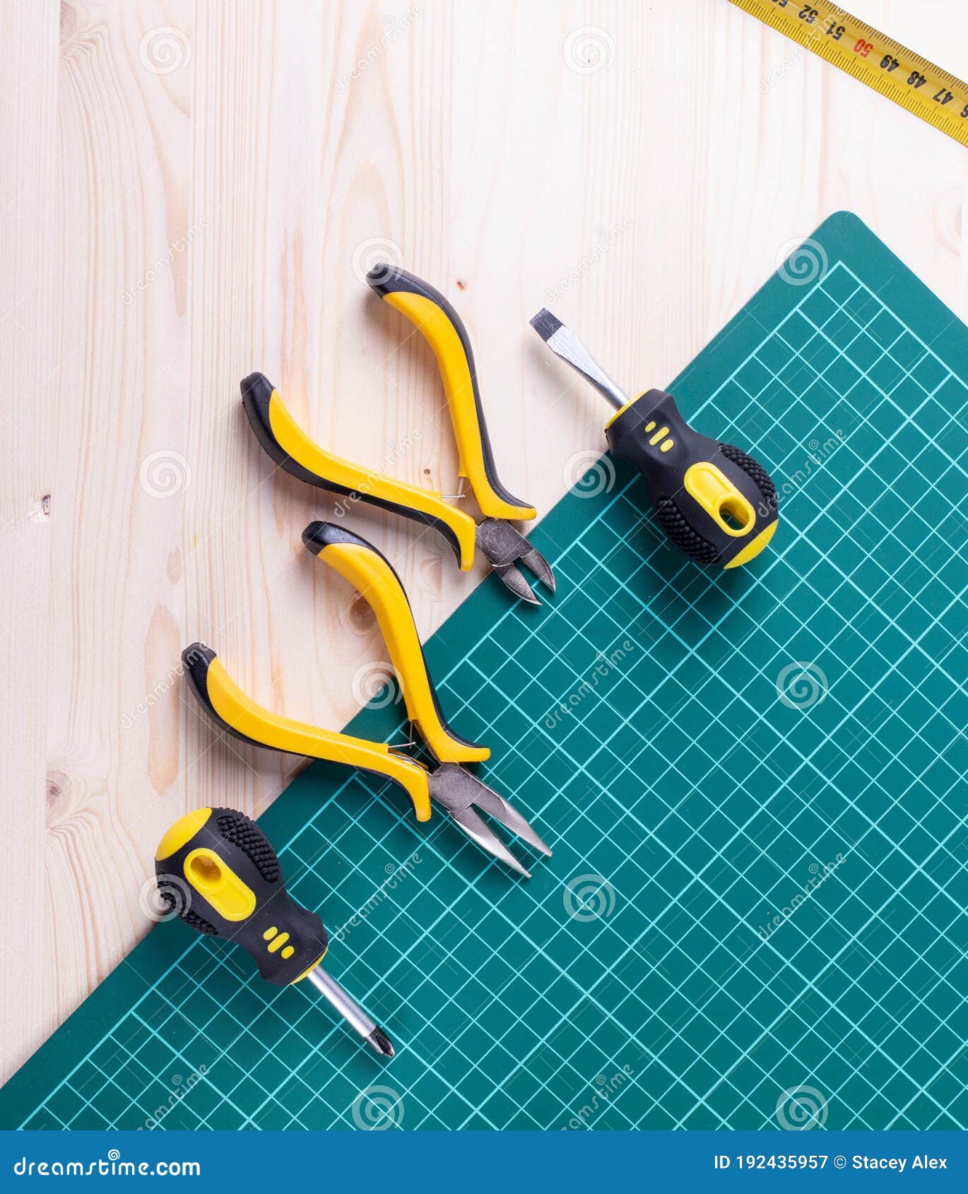 Different Mechanic or Electrician Worker Tools on the Green Checked Mat ...
