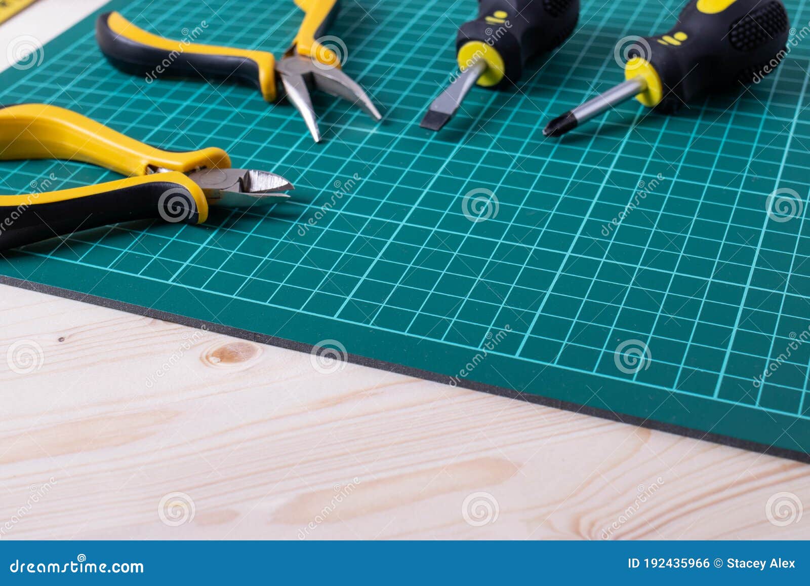 Different Mechanic or Electrician Worker Tools on the Green Checked Mat ...
