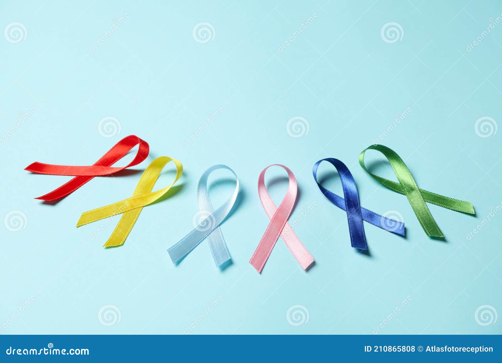 Different Multi Colored Awareness Ribbons on Blue Background Stock ...