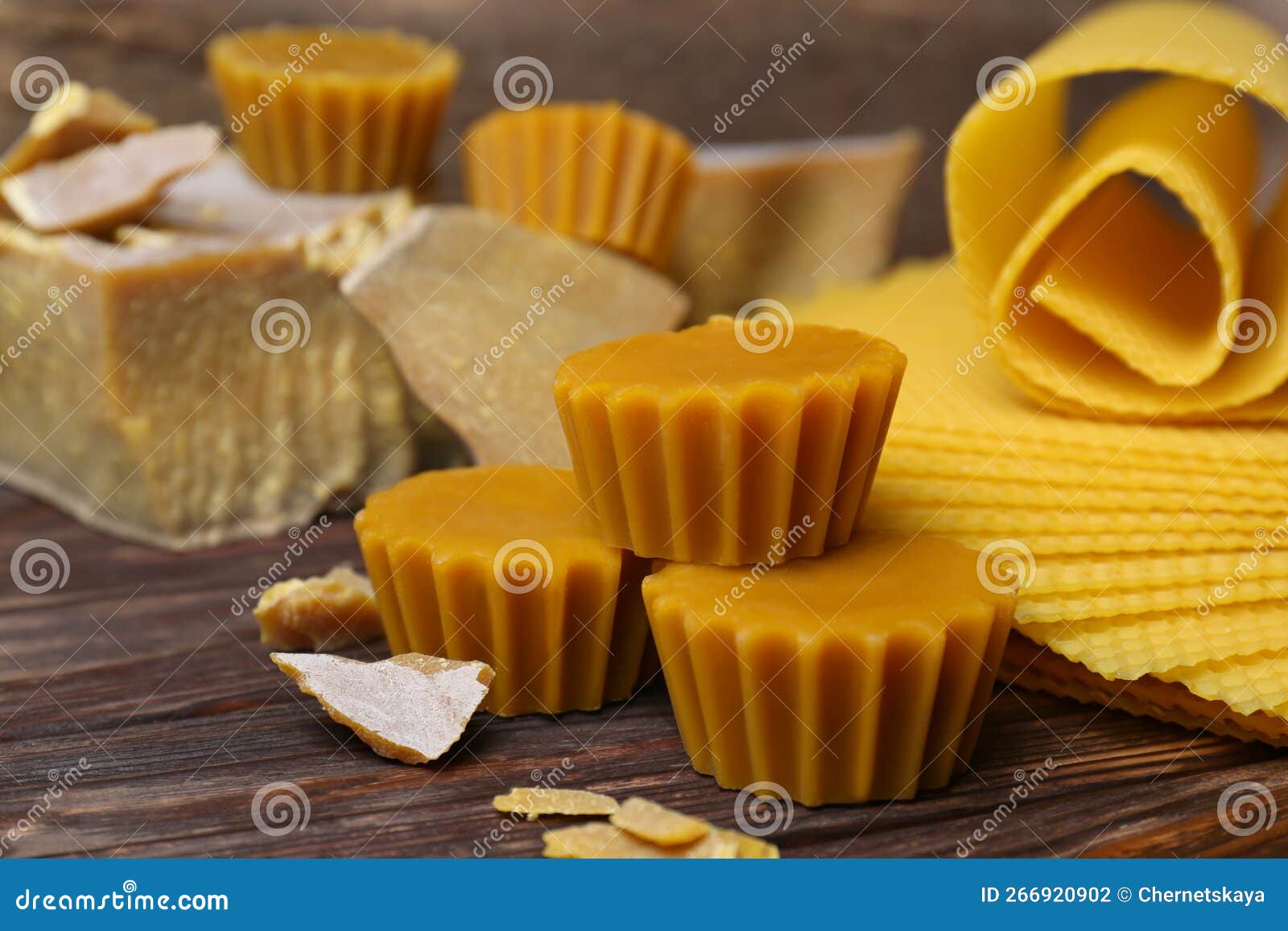 Different Natural Beeswax Blocks and Sheets on Wooden Table, Closeup ...