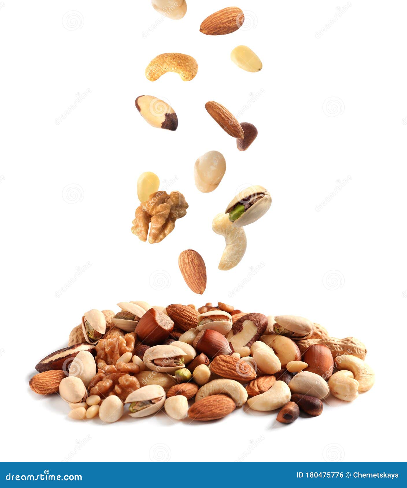 Different Nuts Falling into Pile on Background Stock Photo - Image of ...