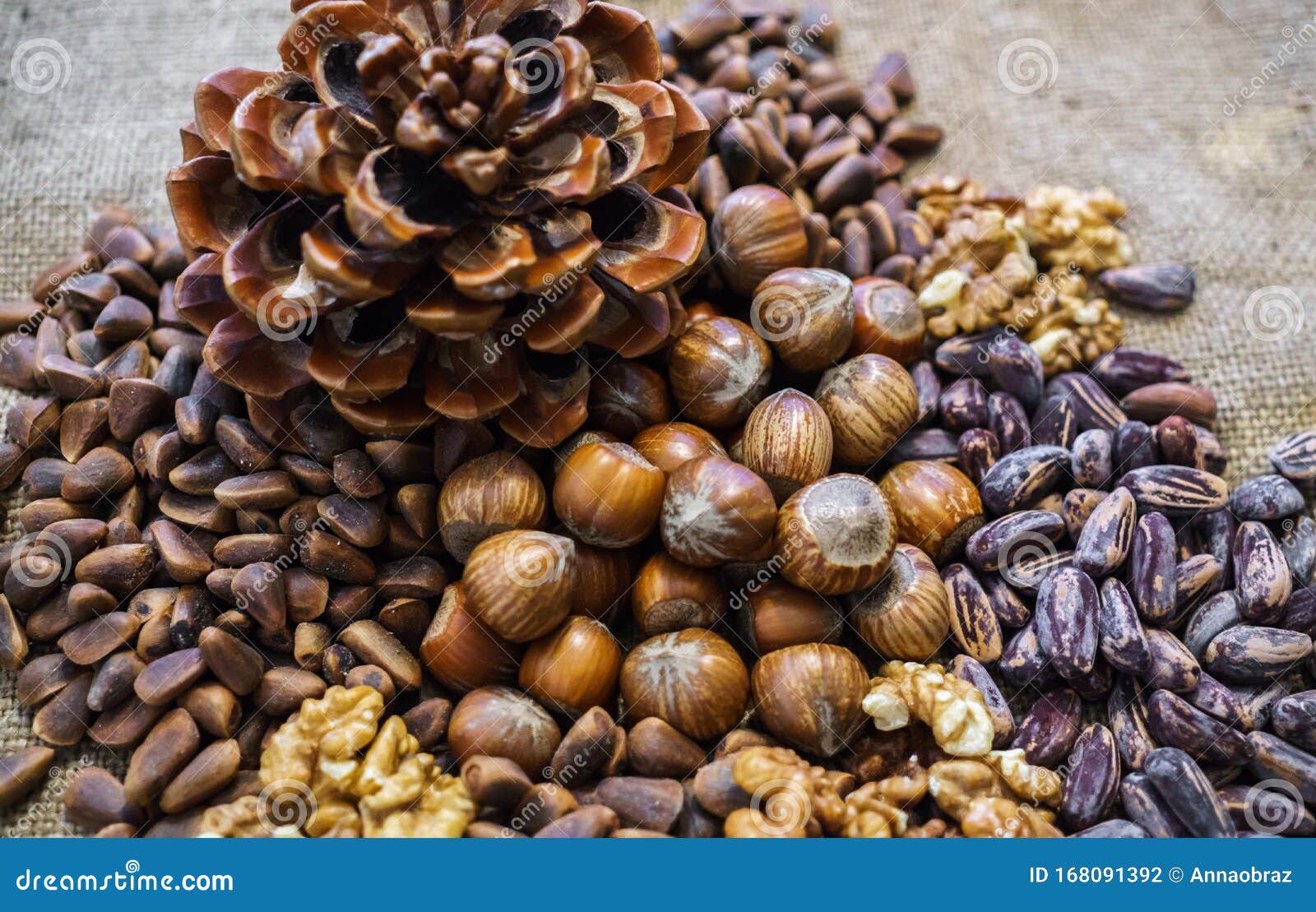 Different Nuts in the Shell and without it Scattered on the Table Stock ...