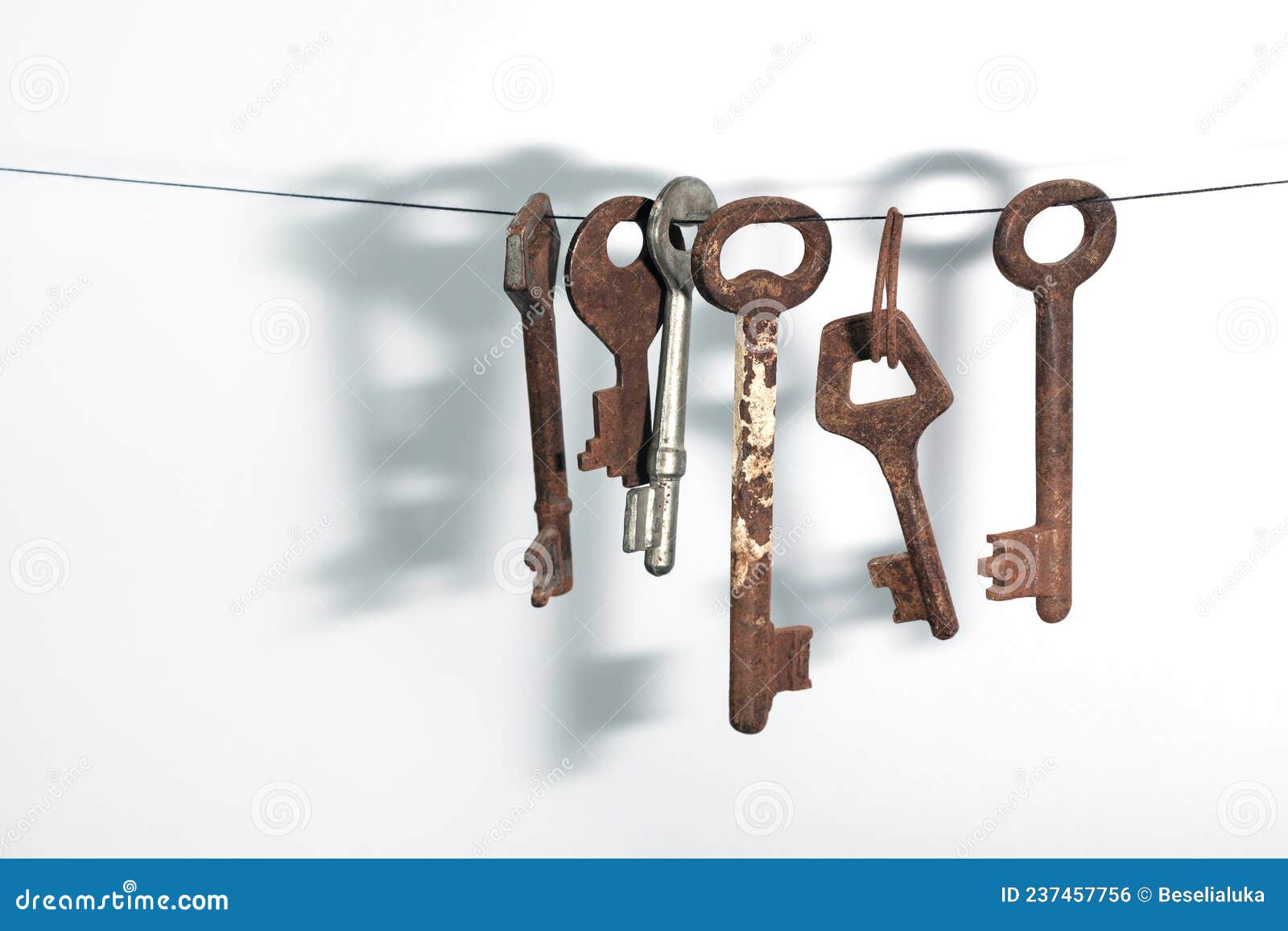 A Different Old Retro Rusty Keys from Different Locks Hanging on String ...