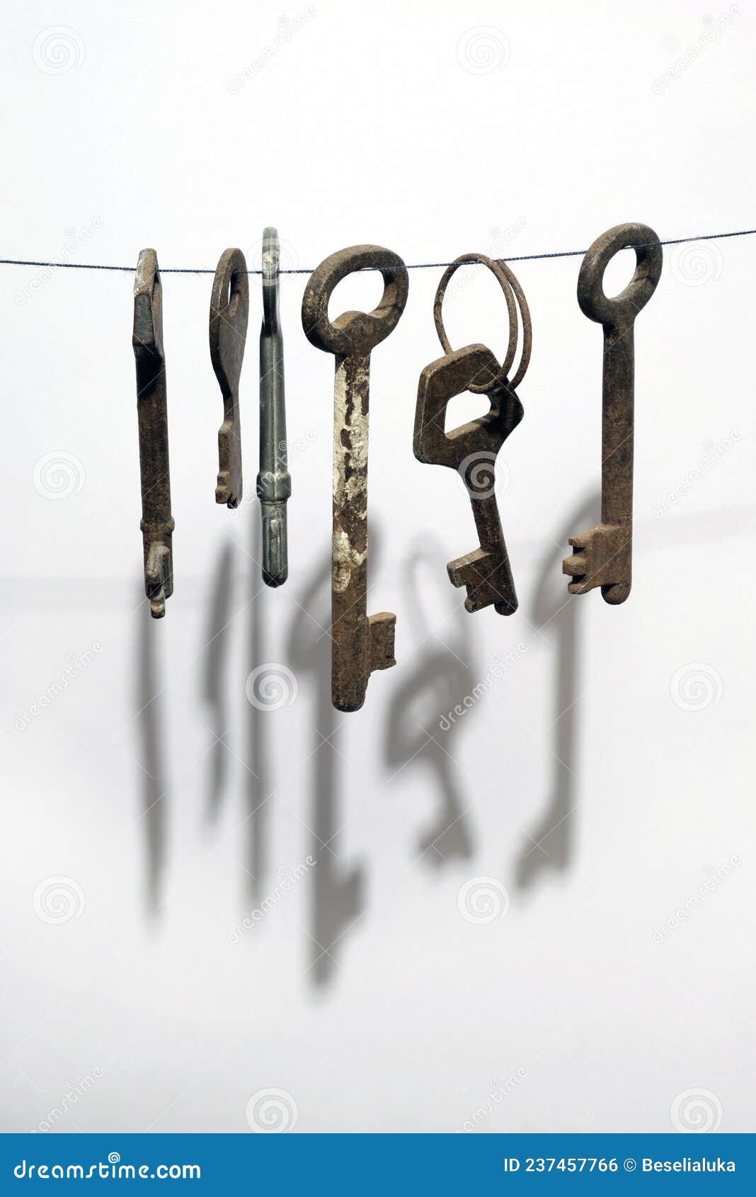 A Different Old Retro Rusty Keys from Different Locks Hanging on String ...