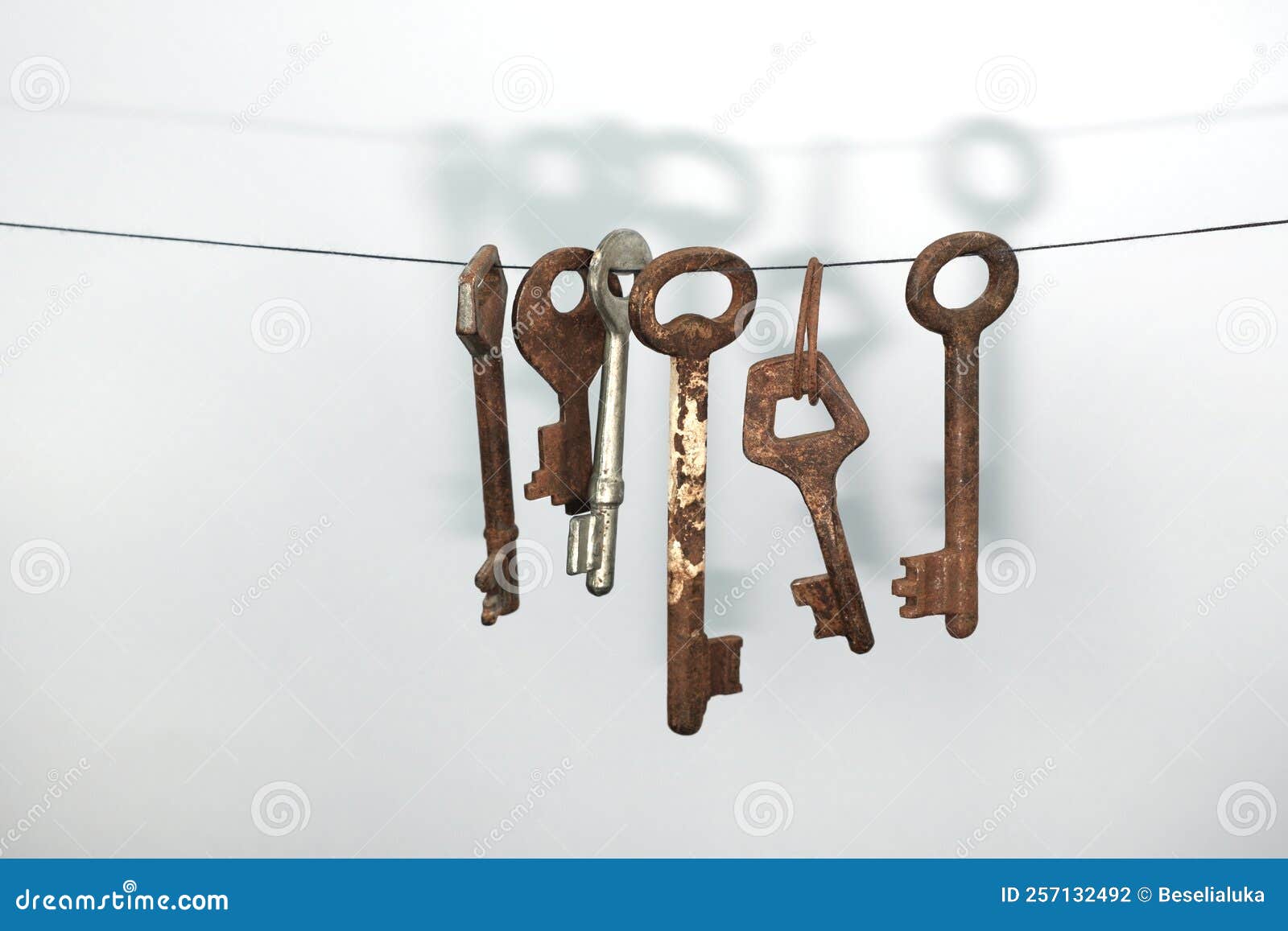 A Different Old Retro Rusty Keys from Different Locks Hanging on String ...