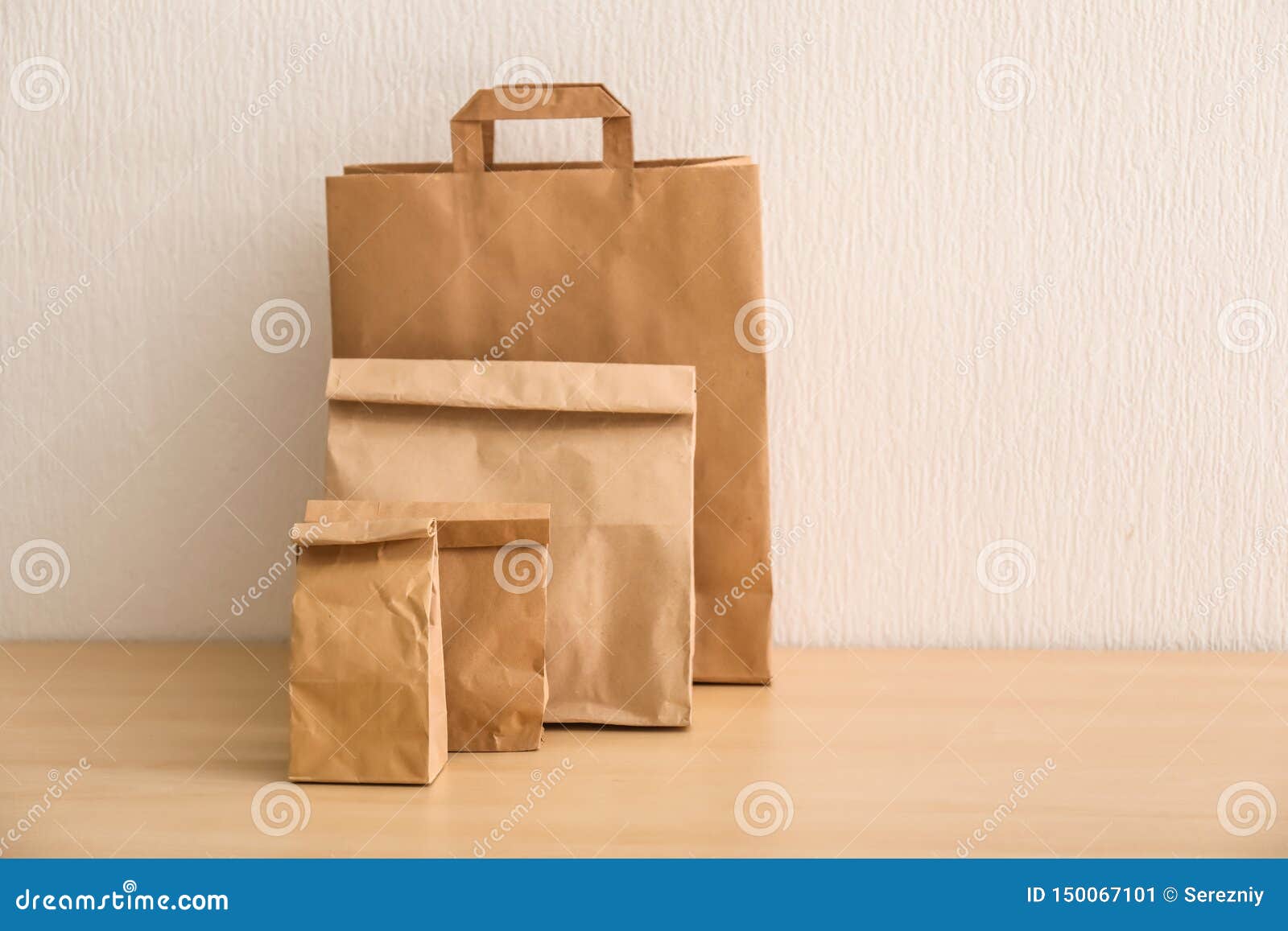 Different Paper Bags on Light Table. Food Delivery Service Stock Image ...
