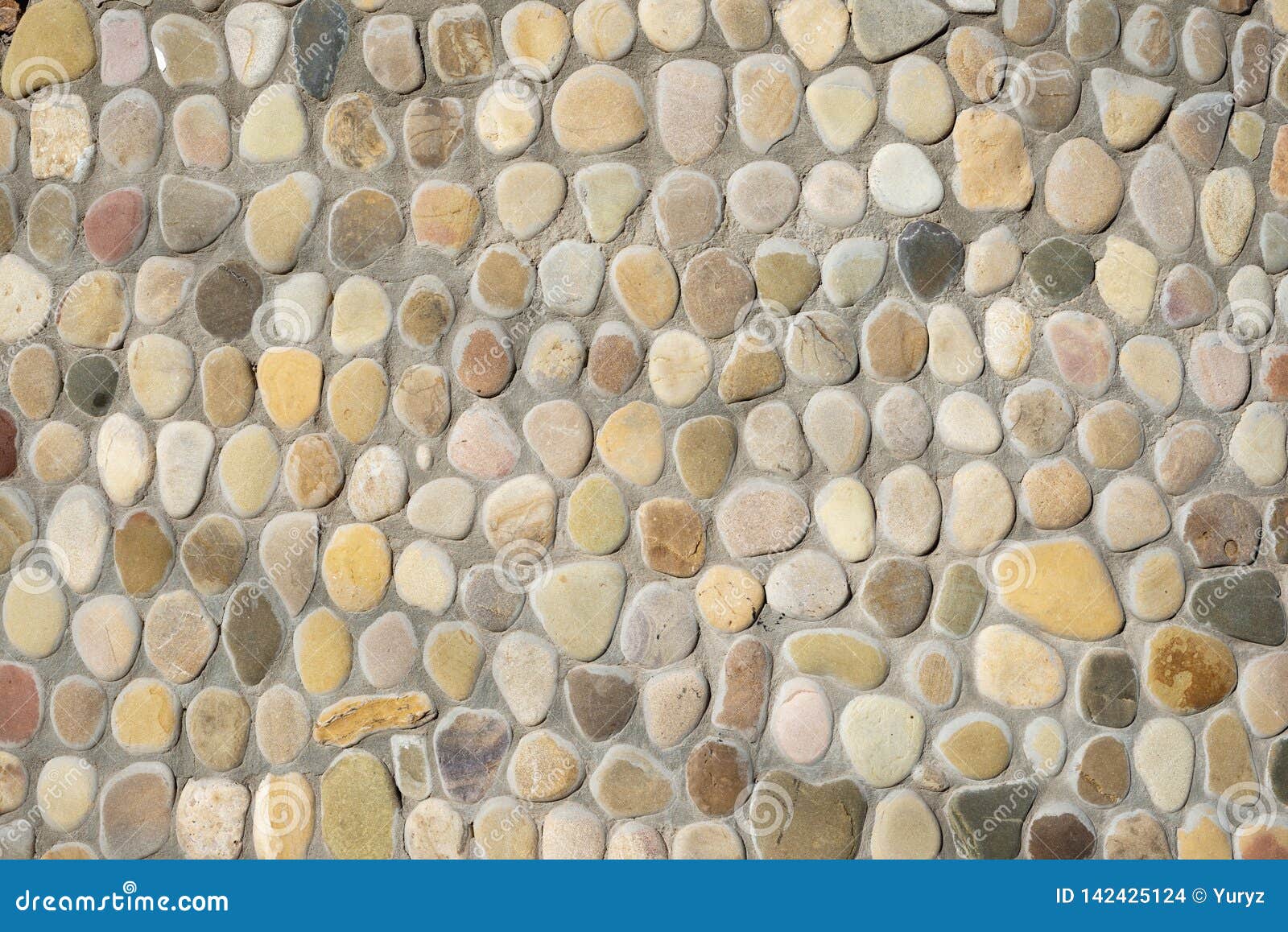 Different pebbles pavement stock photo. Image of natural - 142425124