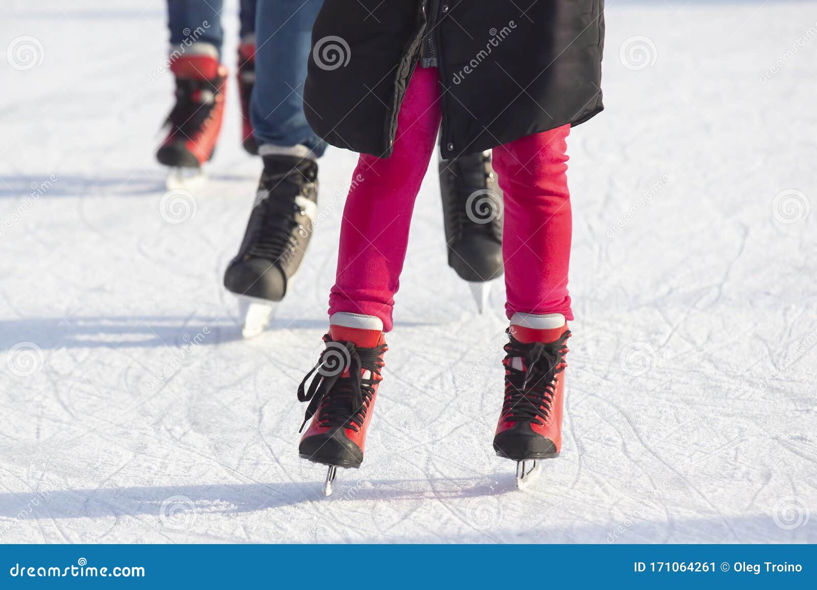 Different People are Actively Skating on an Ice Rink Stock Image ...