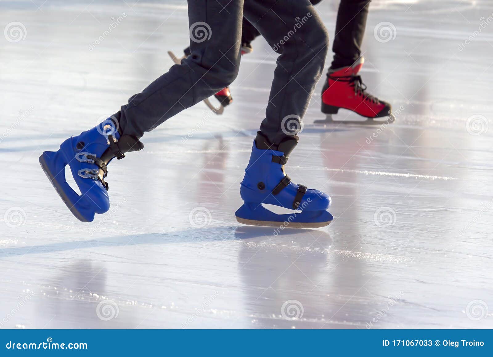 Different People are Actively Skating on an Ice Rink Stock Image ...