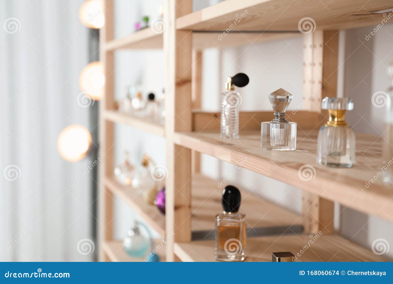 Different Perfume Bottles on Wooden Rack Stock Photo - Image of bottle ...