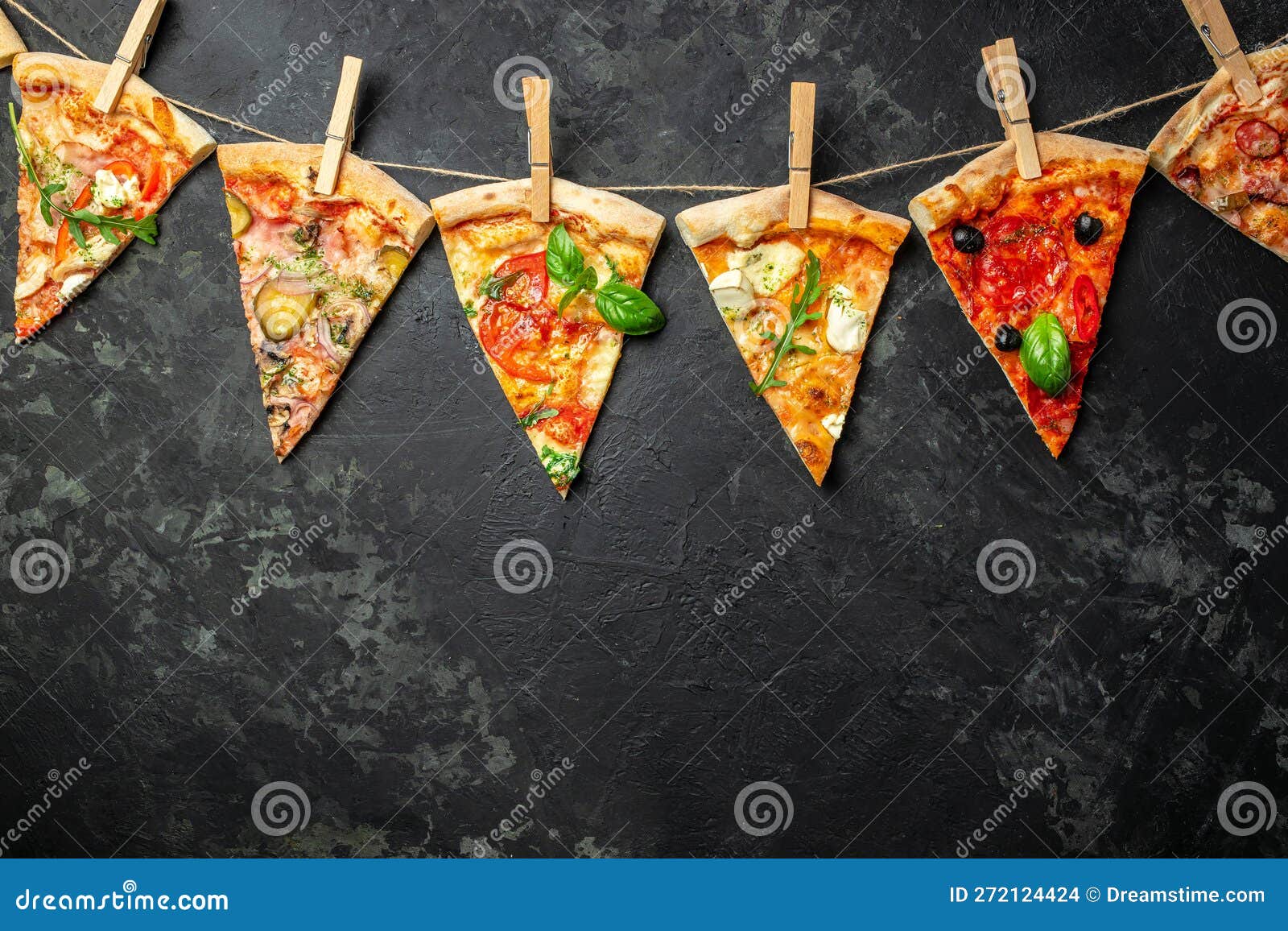 Different Pieces of Pizza on a Cord with Clothespins Dark Background ...