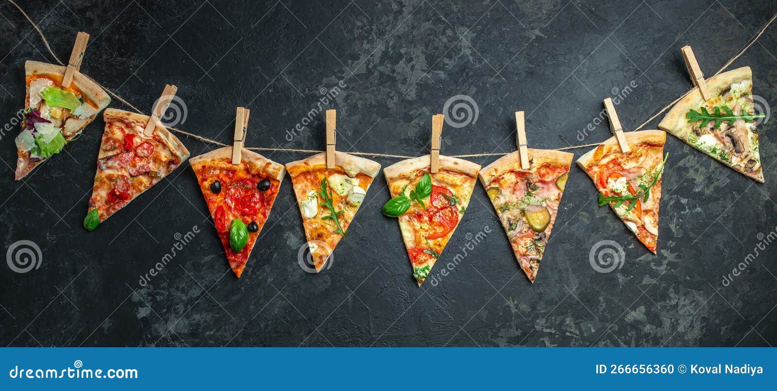 Different Pieces of Pizza on a String with Clothespins Dark Background ...