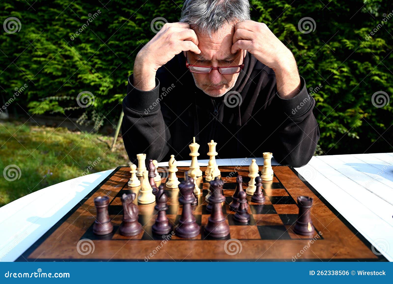 A Man is Playing Chess and Thinking of a Strategy Stock Photo - Image ...
